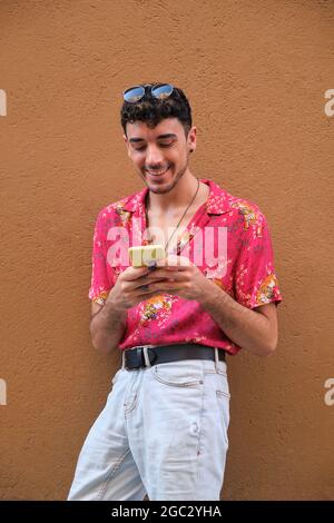 Young caucasian man with long false nails dancing at street ...