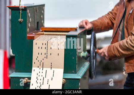 A barrel organ (also called roller organ or crank organ) is a French ...