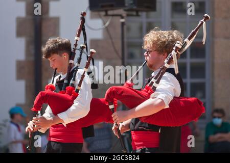 Two Breton musicians in traditional costume playing bagpipes Stock ...
