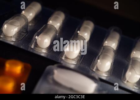 Closeup shot of pharmaceutical capsules, pills and syringes Stock Photo ...