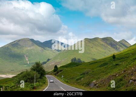 Driving along the A87 through Glen Shiel in the Scottish Highlands ...