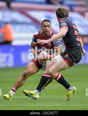 Willie Isa #11 of Wigan Warriors is tackled by George King #10 and Matt ...
