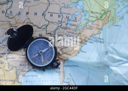 Old compass on the Russian-language map of the world. Concept Stock ...