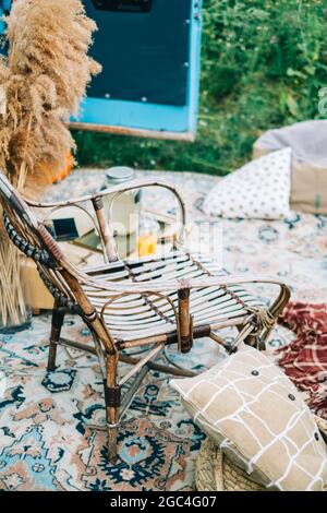 Cozy place near blue van with wooden chair and mini table Stock Photo ...