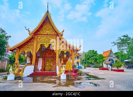 The Ubosot of the medieval Wat Sangkharam Temple with sculptures of ...