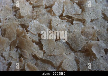 Raw kerupuk gendar (puli, kerupuk beras, Lempeng Puli) with a natural ...
