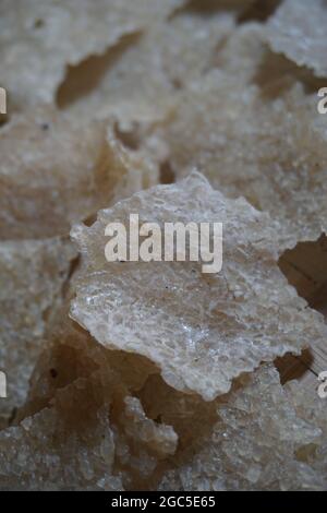 Raw kerupuk gendar (puli, kerupuk beras, Lempeng Puli) with a natural ...