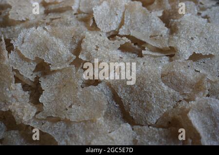 Raw kerupuk gendar (puli, kerupuk beras, Lempeng Puli) with a natural ...