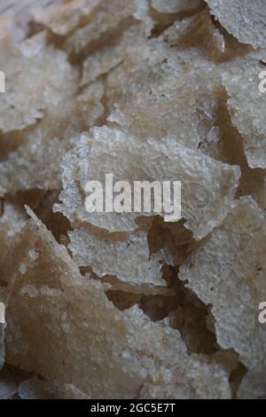 Raw kerupuk gendar (puli, kerupuk beras, Lempeng Puli) with a natural ...
