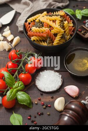 tricolor pepper on a wooden background Stock Photo - Alamy