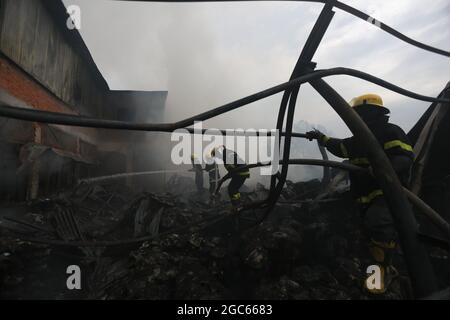 Kathmandu, Nepal. 7th Aug, 2021. Nepalese fire fighters try to ...