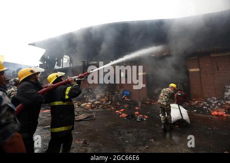 Kathmandu, Nepal. 7th Aug, 2021. Nepalese fire fighters try to ...