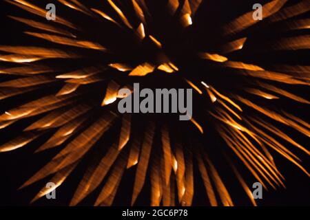 Exploding firework producing a beautiful cascading colourful display ...