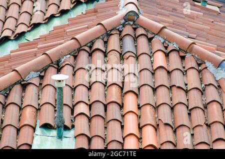 Pitched corrugated steel roof. Chimney with H top stainless steel cowl ...