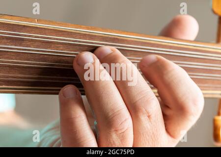 hands of a musician playing the lute in Greece Stock Photo - Alamy