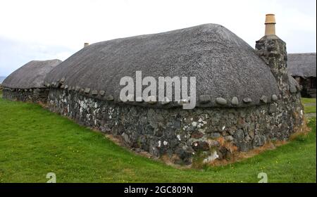 Traditional Scottish Croft; Stone built cottage covered in ivy greenery ...
