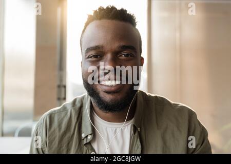 Young hispanic man doing video call with smartphone screaming proud ...