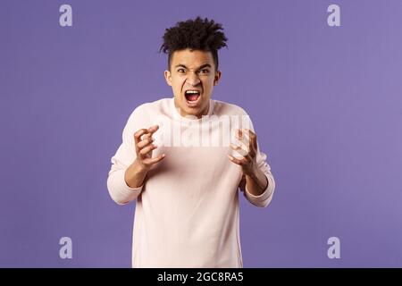 Portrait of hateful, outraged young hispanic man losing his temper ...