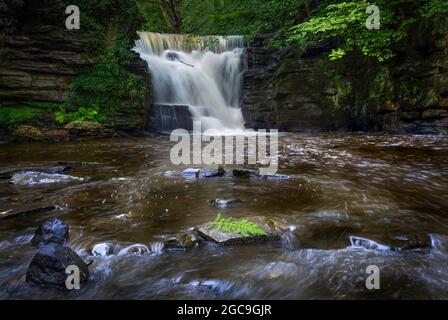 A man made industrial waterfalls near Neath Abbey on the river Clydach ...