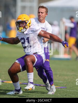 August 7, 2021: LSU running back Corey Kiner (21) takes a hand off ...