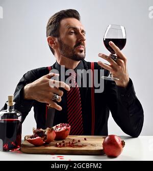 Young male expert holding knife at workshop Stock Photo - Alamy