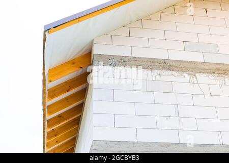 Eaves overhang of the roof of a private house in the process of ...