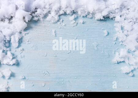 Real, natural snow on blue wooden background. Winter time idea Stock ...
