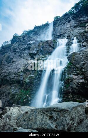 beautiful nuranang waterfalls and stream flowing on the boulders ...