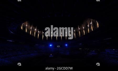 Tokyo, Japan. 8th Aug, 2021. Fireworks explode over the Olympic Stadium ...