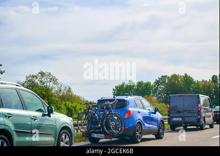 Freeway 11, Germany - September 15, 2019: Car with a bike carrier attached to the stern and ...