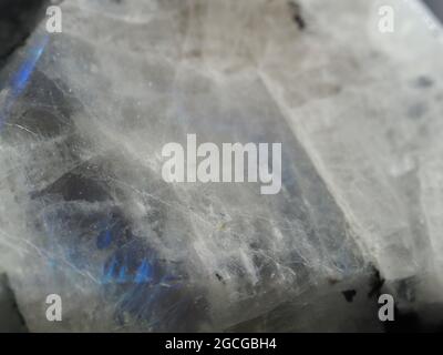 Moonstone with Black and Rainbow Inclusions Stock Photo - Alamy