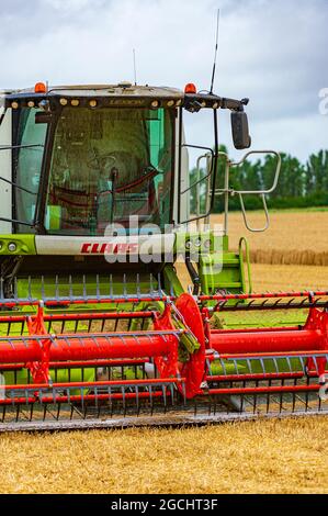 Class 750 Lexion combine harvesters parked up on a stubble field ...