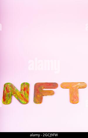 NFT inscription on pink background. Non-fungible token composed of ...