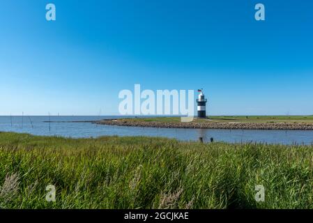 Coastal landscape with the lighthouse Little Prussian in the background ...