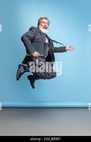 Scared professor, teacher, gray-headed bearded man running, hurrying to ...
