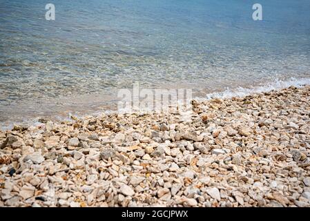 Pebbles on seashore Stock Photo - Alamy