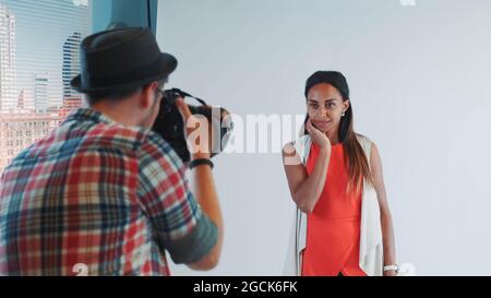 Backside view of photographer taking photo of beautiful multiracial ...
