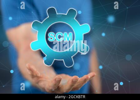 Scm concept above the hand of a man in background Stock Photo - Alamy