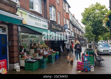 London August 2021: Pitshanger Lane shops, a busy high street of ...