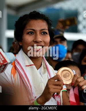 Boxer Lovlina Borgohain shows her Olympic 2020 bronze medal during an ...