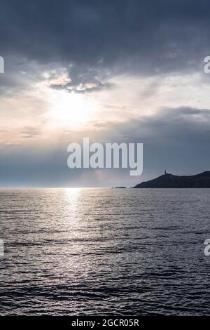 Prasonisi lighthouse in evening light, dramatic cloudy sky, Rhodes ...