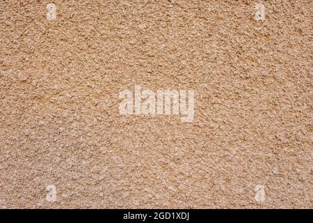 Orange-colored bumpy spotted rough wall texture Stock Photo - Alamy
