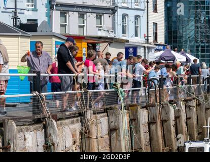 Brixham, UK. Tuesday 10 August 2021. Good weather fills the town of ...