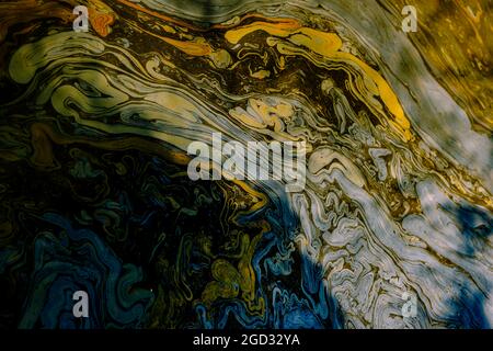 Rainbow colors created by diesel fuel floating on the water Stock Photo ...