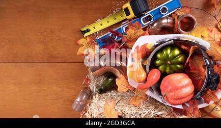 Happy Thanksgiving with construction tools, maple leaves and pumpkin on ...