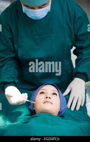 Patient on operating table receiving plastic surgery Stock Photo - Alamy
