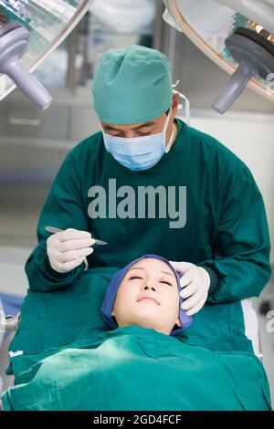 Patient on operating table receiving plastic surgery Stock Photo - Alamy
