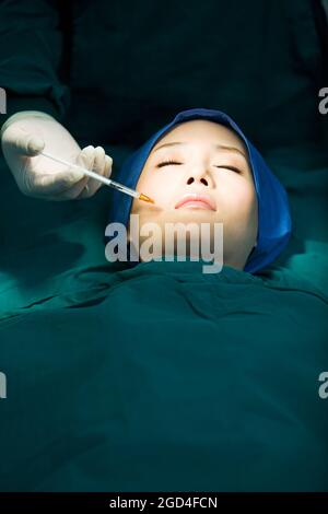 Patient on operating table receiving plastic surgery Stock Photo - Alamy