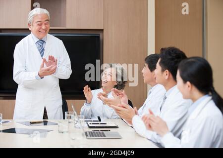 Medical experts clapping Stock Photo - Alamy