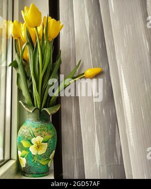 A vertical shot of a garden filled with colorful traditional Chinese ...